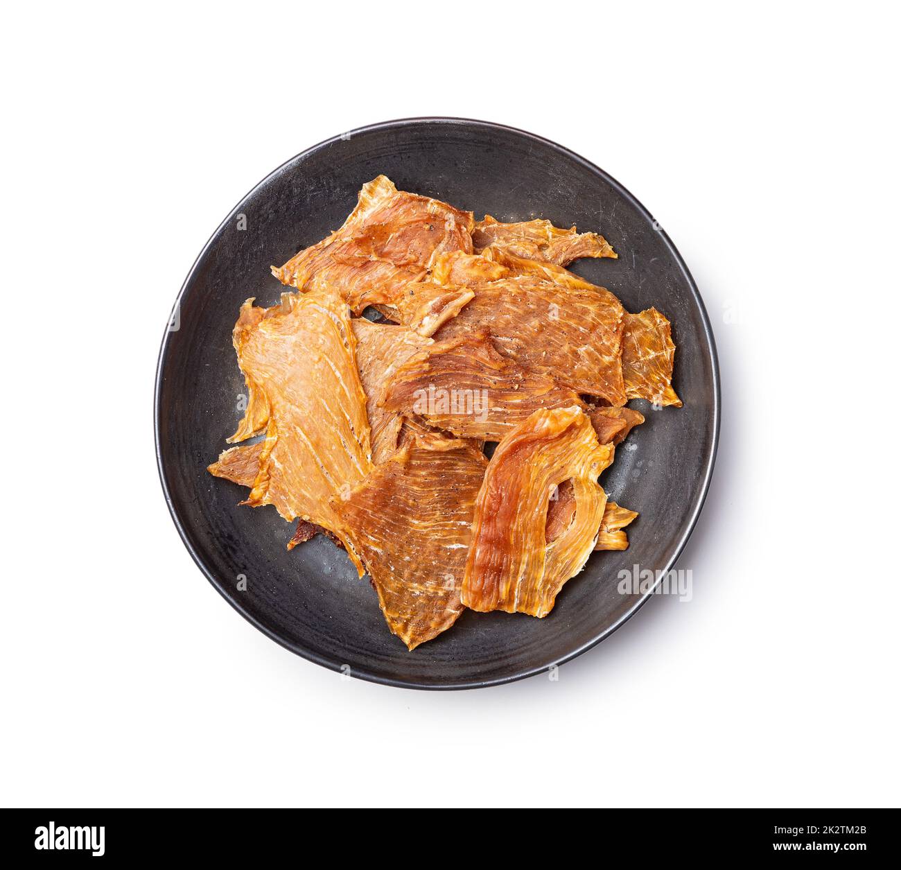 Turkey jerky meat on plate. Dried sliced meat isolated on white ...