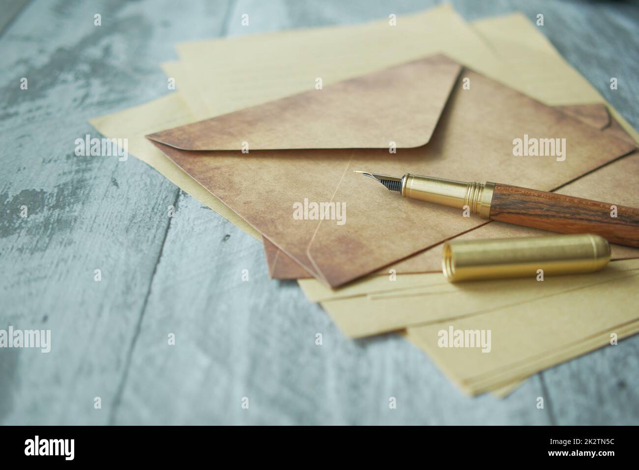 envelope , empty paper and fountain pen on table Stock Photo - Alamy
