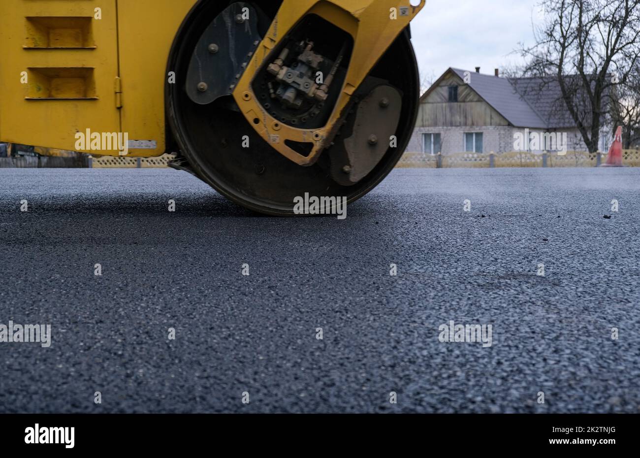 Close up view of a road roller working on a new road construction site ...