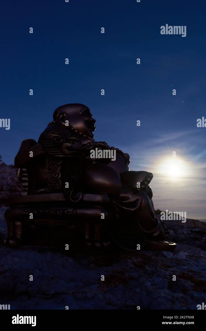 Buddha statue under sunset hi-res stock photography and images - Alamy