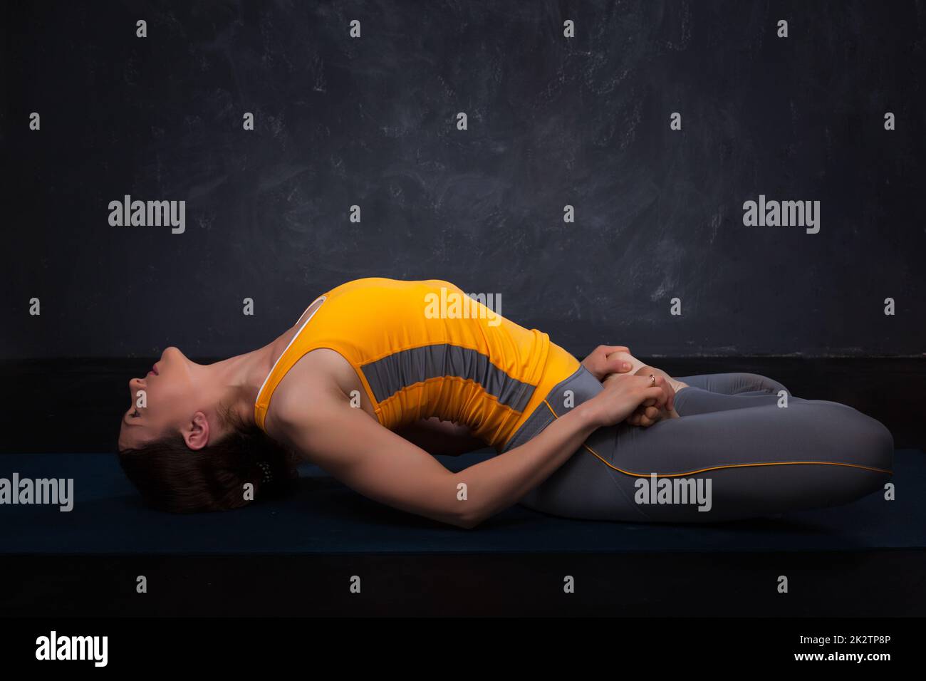 Beautiful sporty fit yogi girl practices yoga asana Matsyasana Stock ...