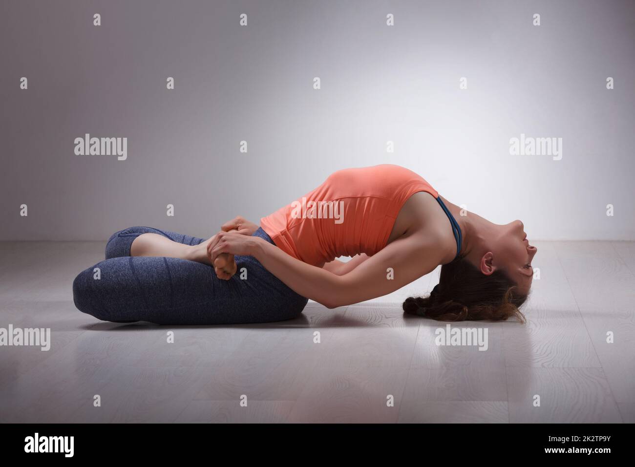 Beautiful sporty fit yogi girl practices yoga asana Matsyasana Stock ...