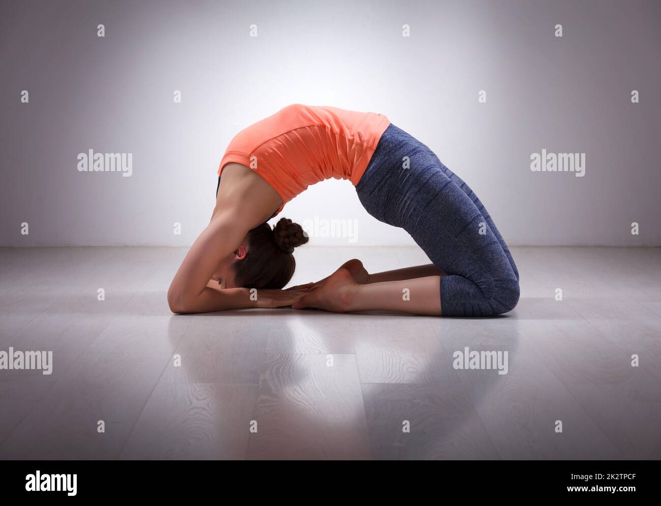 Beautiful sporty fit yogi girl practices yoga asana Kapotasana Stock ...