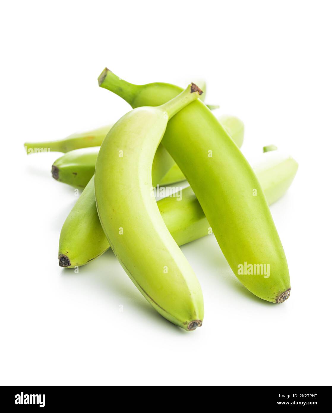 Unripe green bananas isolated on white background Stock Photo - Alamy