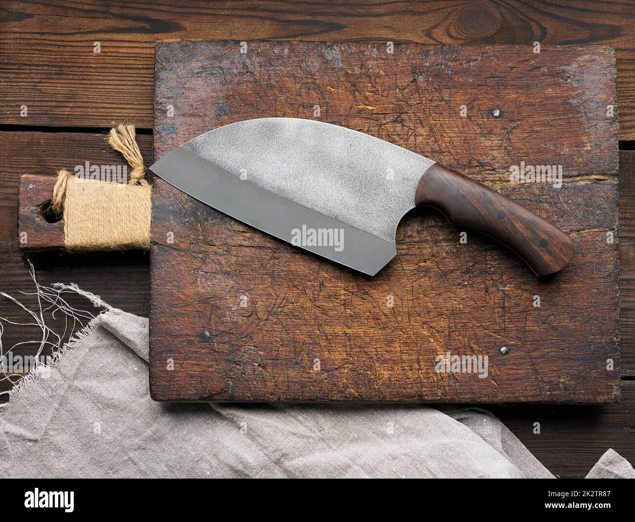 Large kitchen knife on an empty wooden cutting board, top view Stock ...