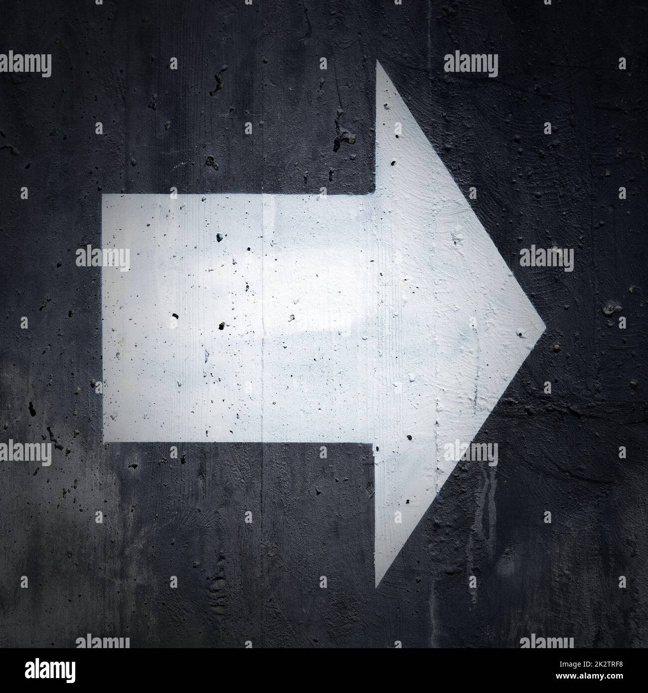 directional arrow pointing to the right on a concrete house wall Stock ...