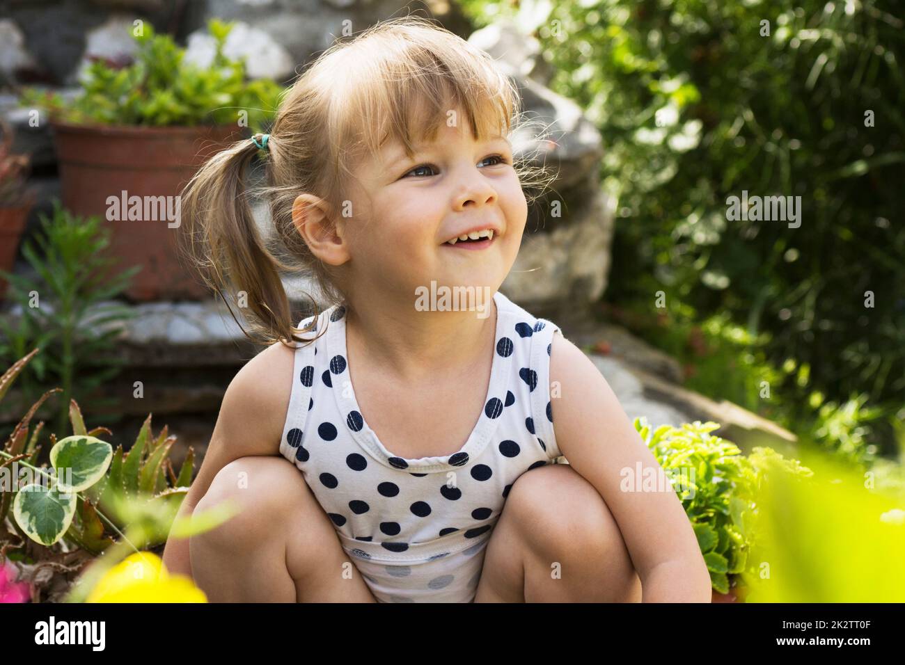 Girl playing hair outdoors hi-res stock photography and images - Alamy