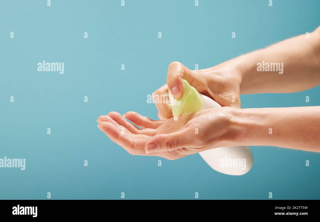 Crop woman applying soap on hands Stock Photo - Alamy