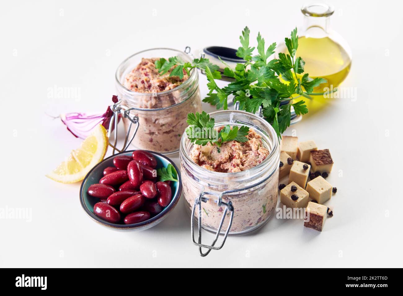 Delicious red bean pate in jars with assorted ingredients on white ...