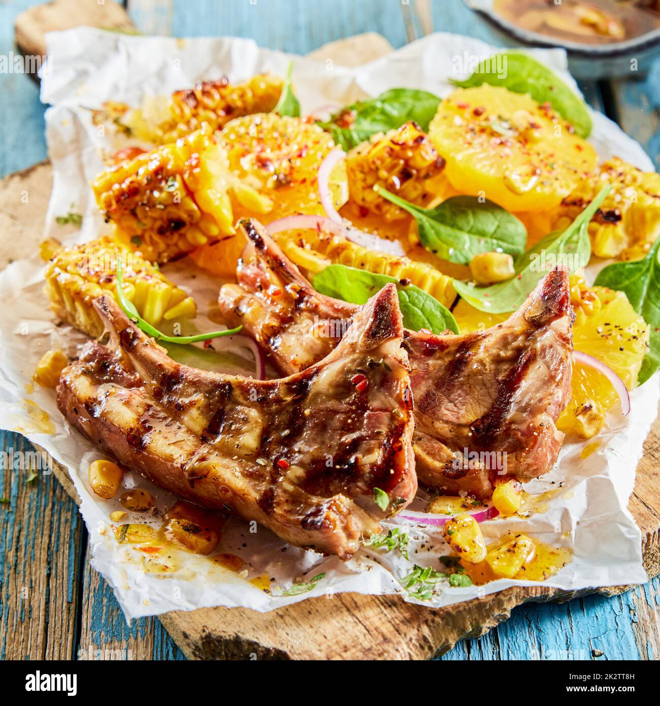 Delicious lamb chops on wooden board Stock Photo - Alamy
