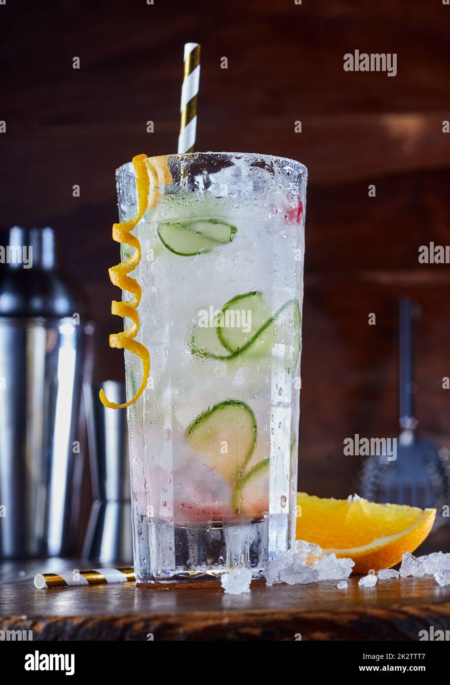 Glass of cocktail with cucumber placed on bar counter Stock Photo - Alamy