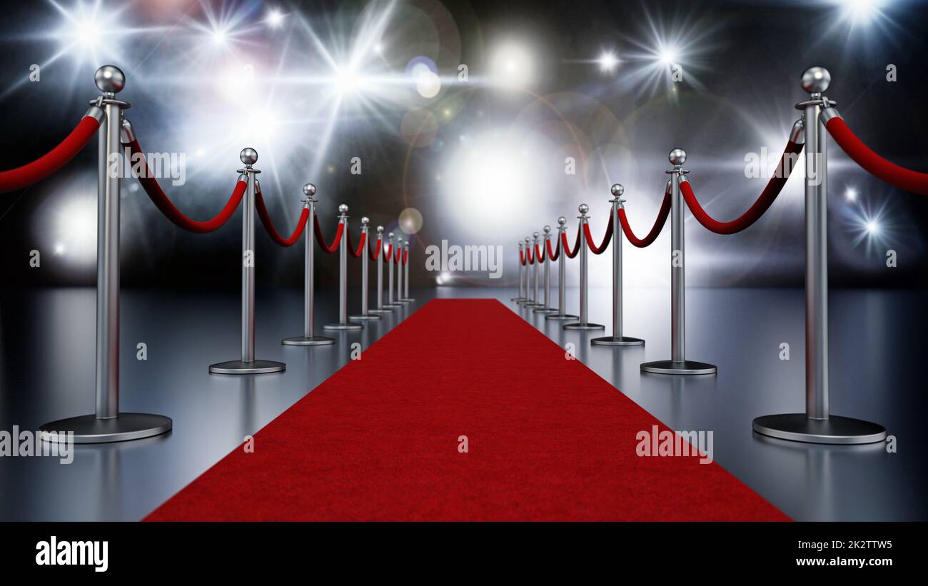 Red carpet and velvet ropes against night background with flashlights ...