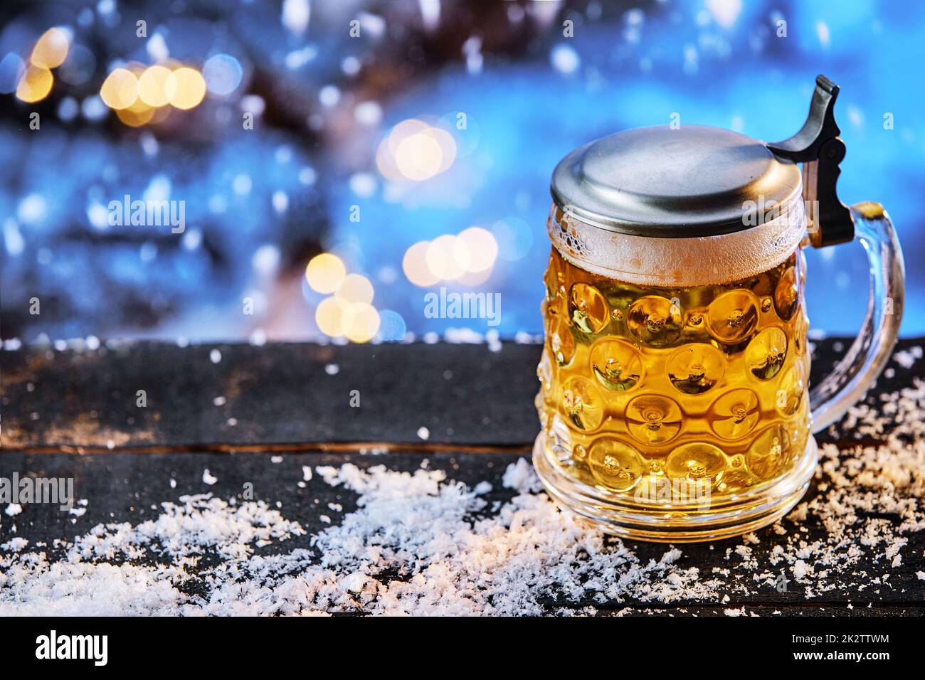Glass of beer on table with snow Stock Photo - Alamy