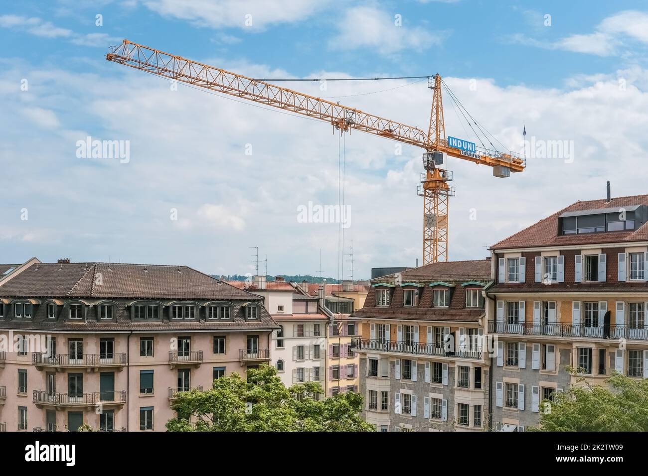 Geneva, Switzerland- August 2022: A modern construction crane towers ...