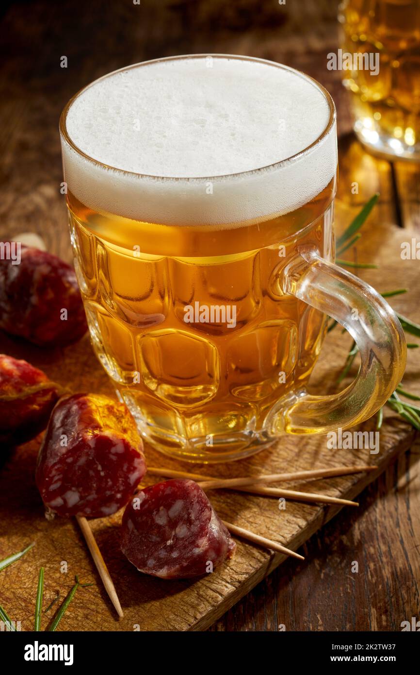 Close up on the frothy head of a cold tankard of beer or lager Stock ...