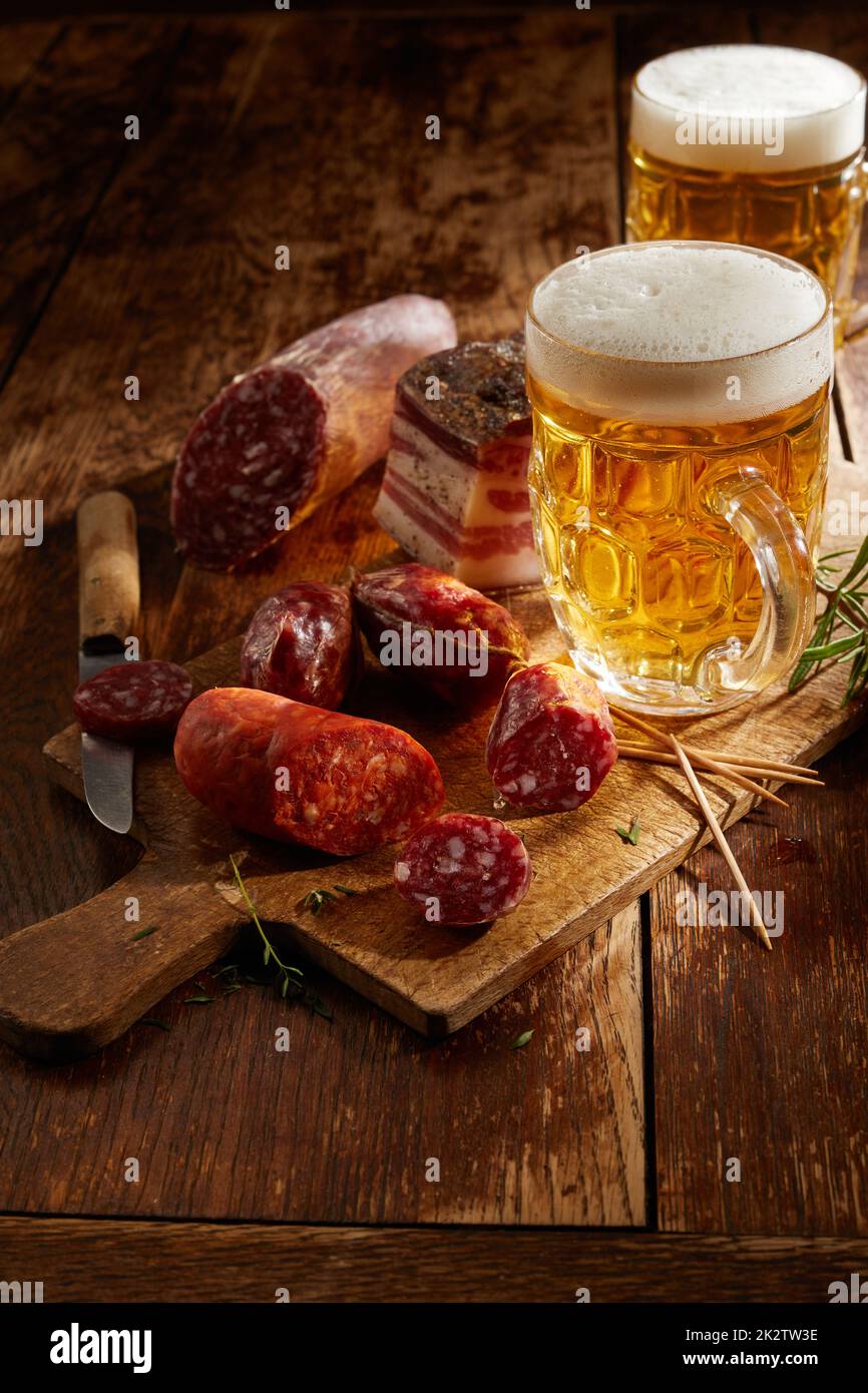 Serving for two with ice cold beers and cold meat selection Stock Photo ...