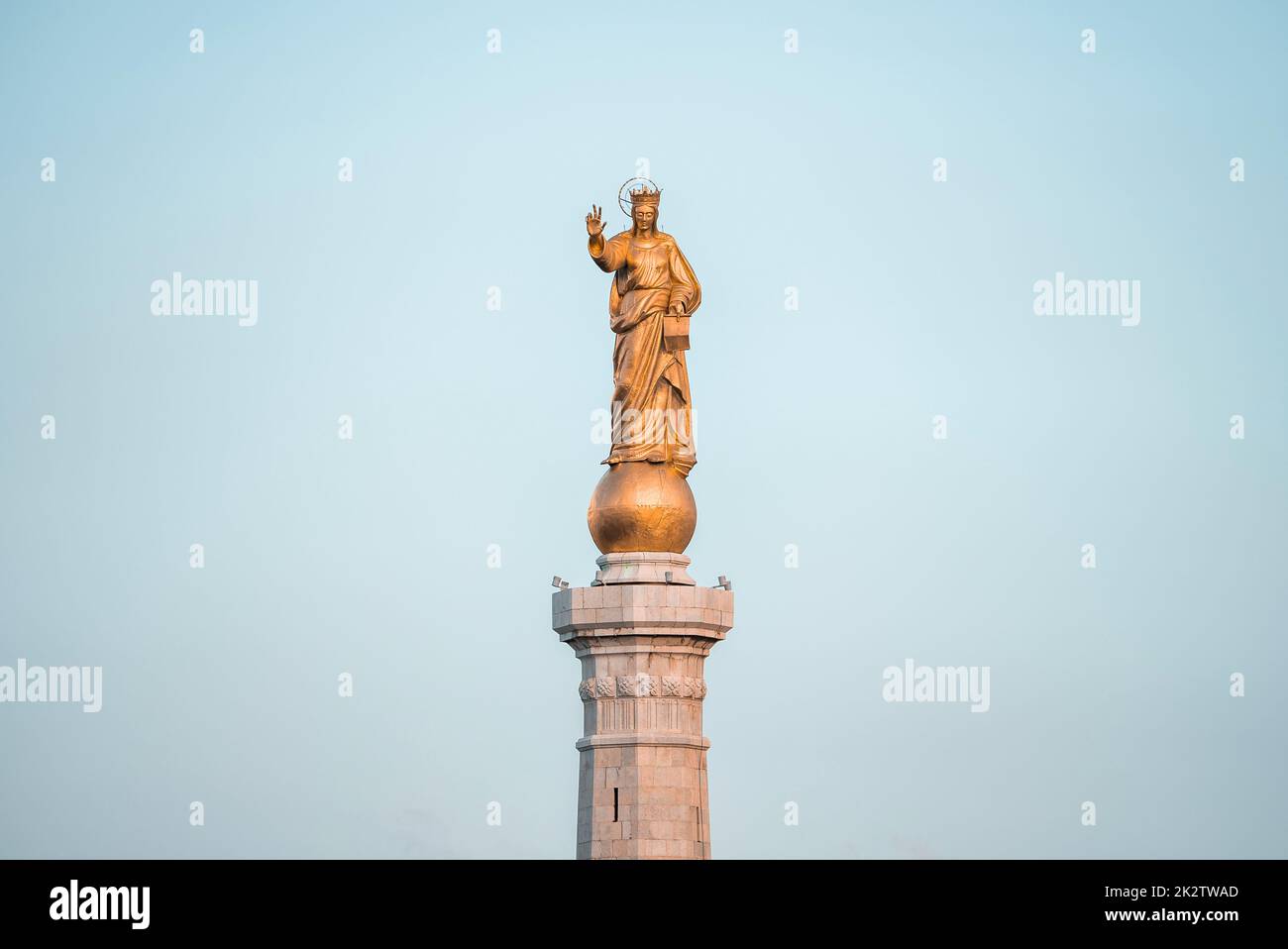 Low angle close-up view of Statue of Golden Madonna with blue sky in ...