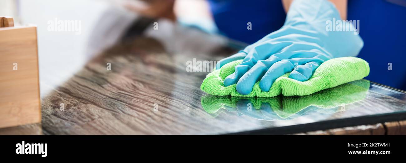 Close-up Of A Janitor Cleaning Desk With Cloth Stock Photo - Alamy