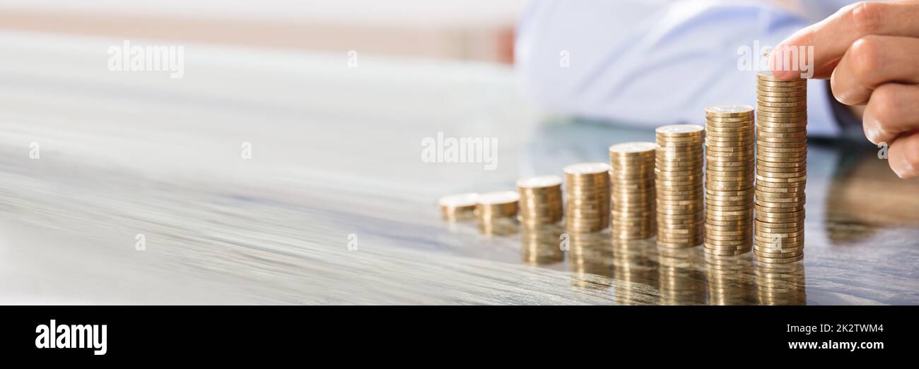 Business man holding coins hi-res stock photography and images - Alamy