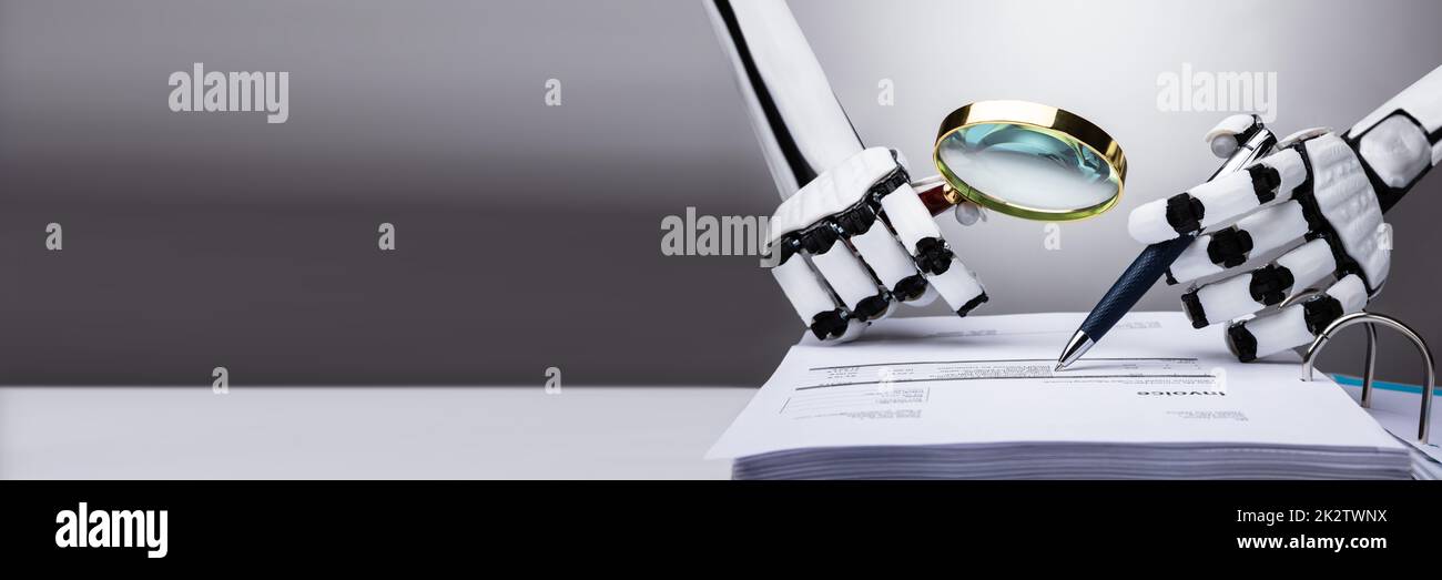 Robot Examining Invoice Stock Photo - Alamy