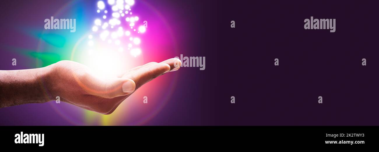 Glowing Lights Flowing From An Open Hand Stock Photo - Alamy