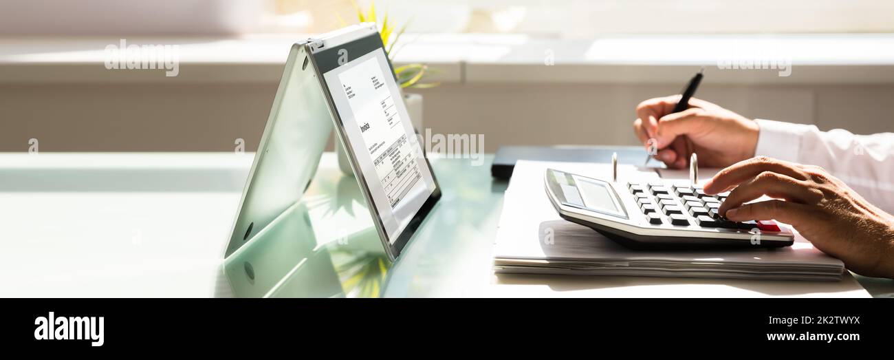 Businessman calculating invoice using calculator Stock Photo - Alamy Businessman calculating invoice using calculator Stock Photo - Alamy