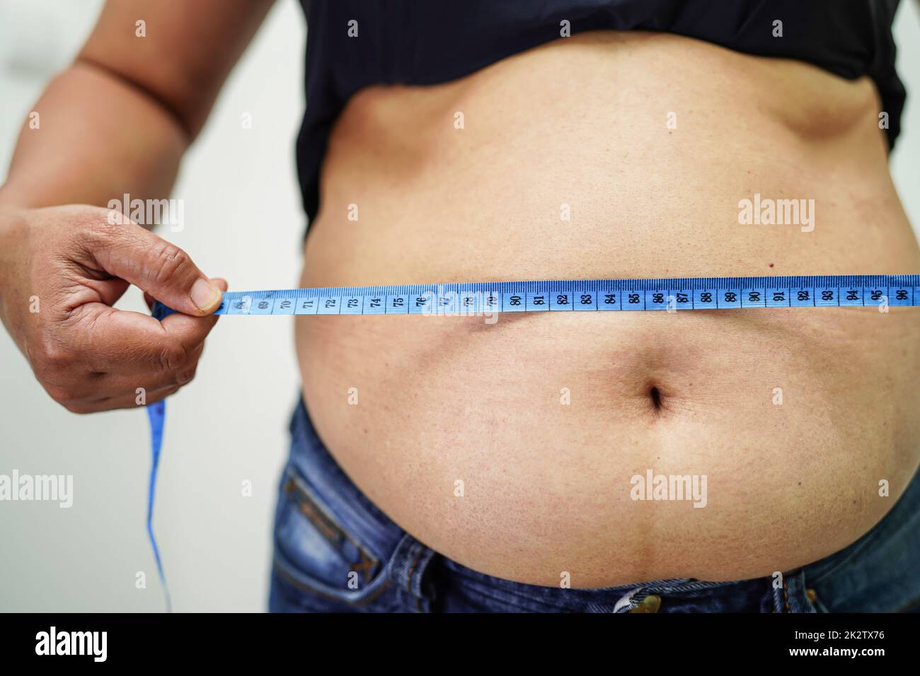 Asian woman show fat belly big size overweight and obesity at office ...