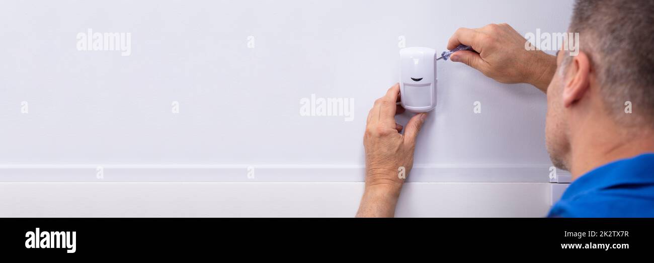 Electrician Installing Security System Door Sensor Stock Photo - Alamy