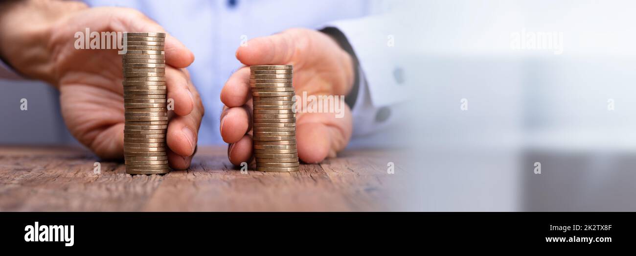 Business man holding coins hi-res stock photography and images - Alamy