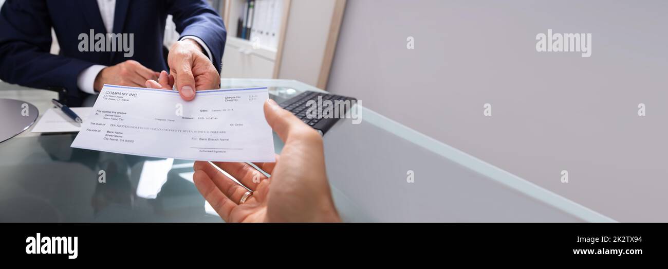 Man holding cheque hi-res stock photography and images - Alamy