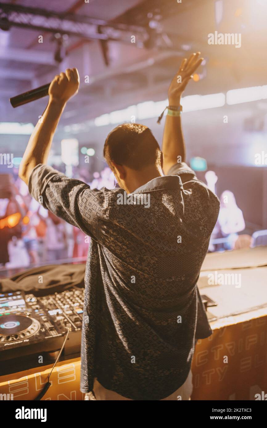 A DJ playing music at the Electrifinity Indoor & Outdoor Music Festival ...