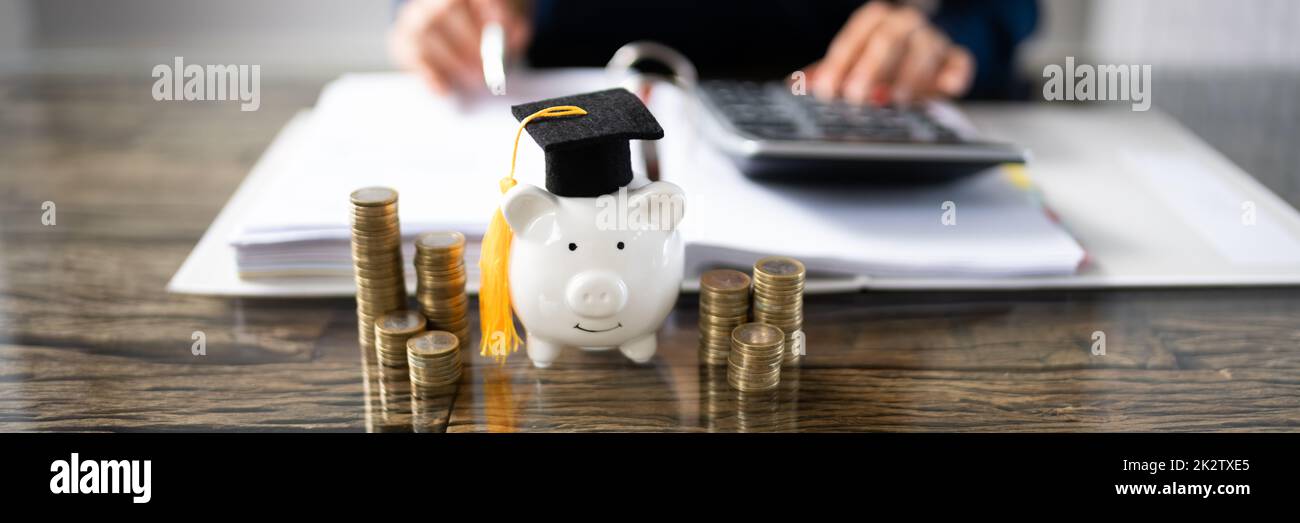 Close-up Of Piggy Bank Wearing Graduation Hat And Stacked Coins Stock ...