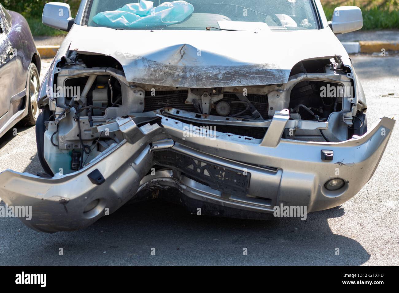 Many broken cars after a traffic accident in the parking lot of a ...