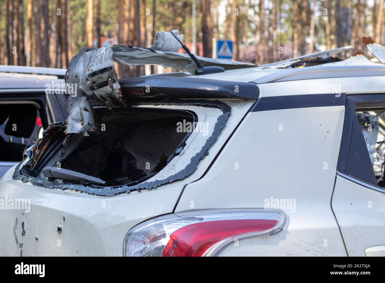 The remains of a civilian car, which was shot and destroyed by shell ...
