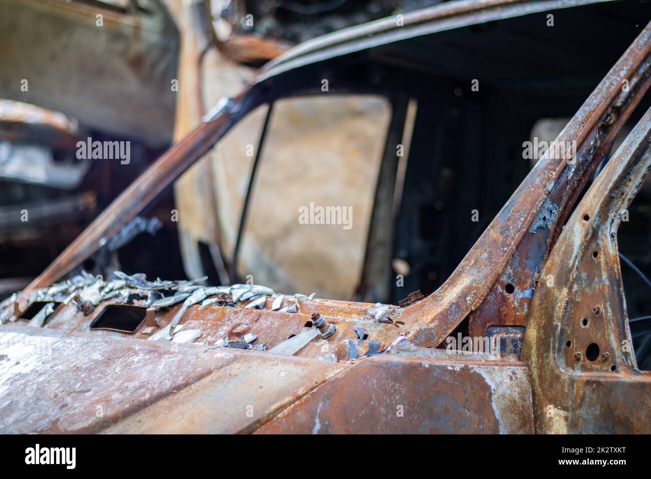 The car was completely destroyed by fire. Abandoned, burnt and rusty ...