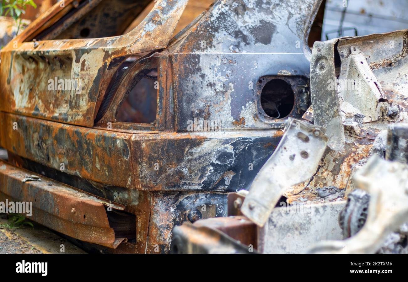 The car was completely destroyed by fire. Abandoned, burnt and rusty ...