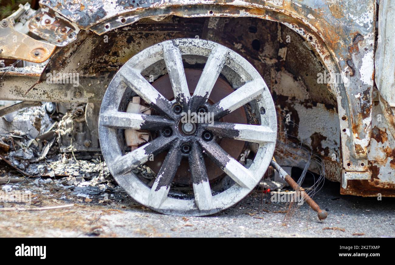 The car was completely destroyed by fire. Abandoned, burnt and rusty ...