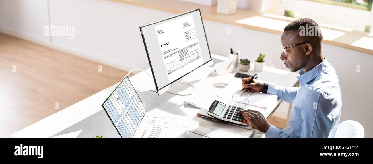 Businessman Using Calculator Calculating Invoice Stock Photo - Alamy