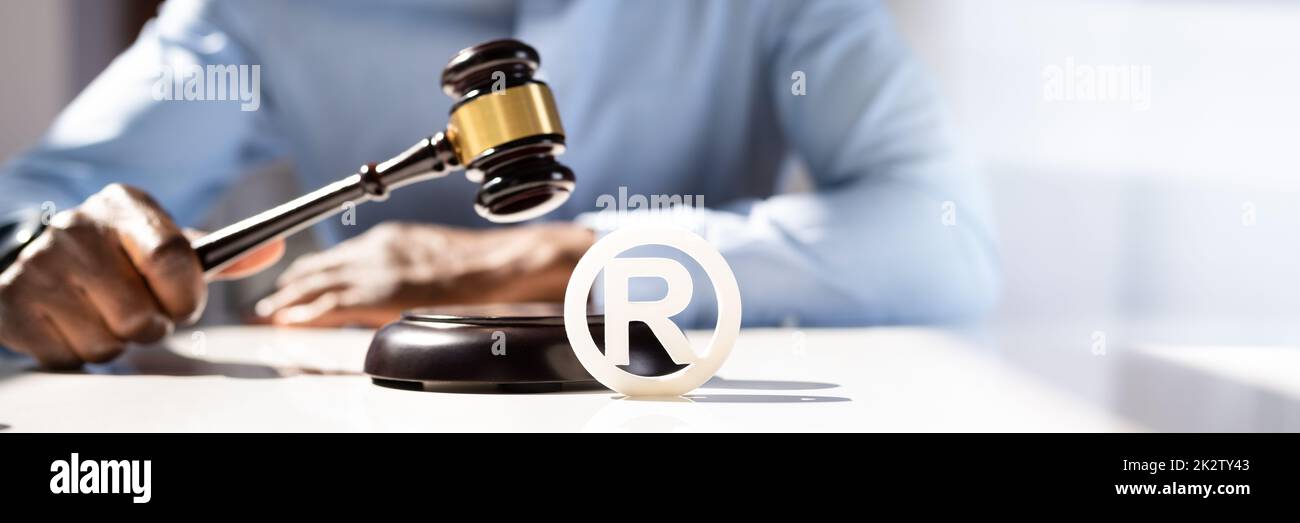 Judge Striking Mallet On Trademark Symbol Stock Photo - Alamy