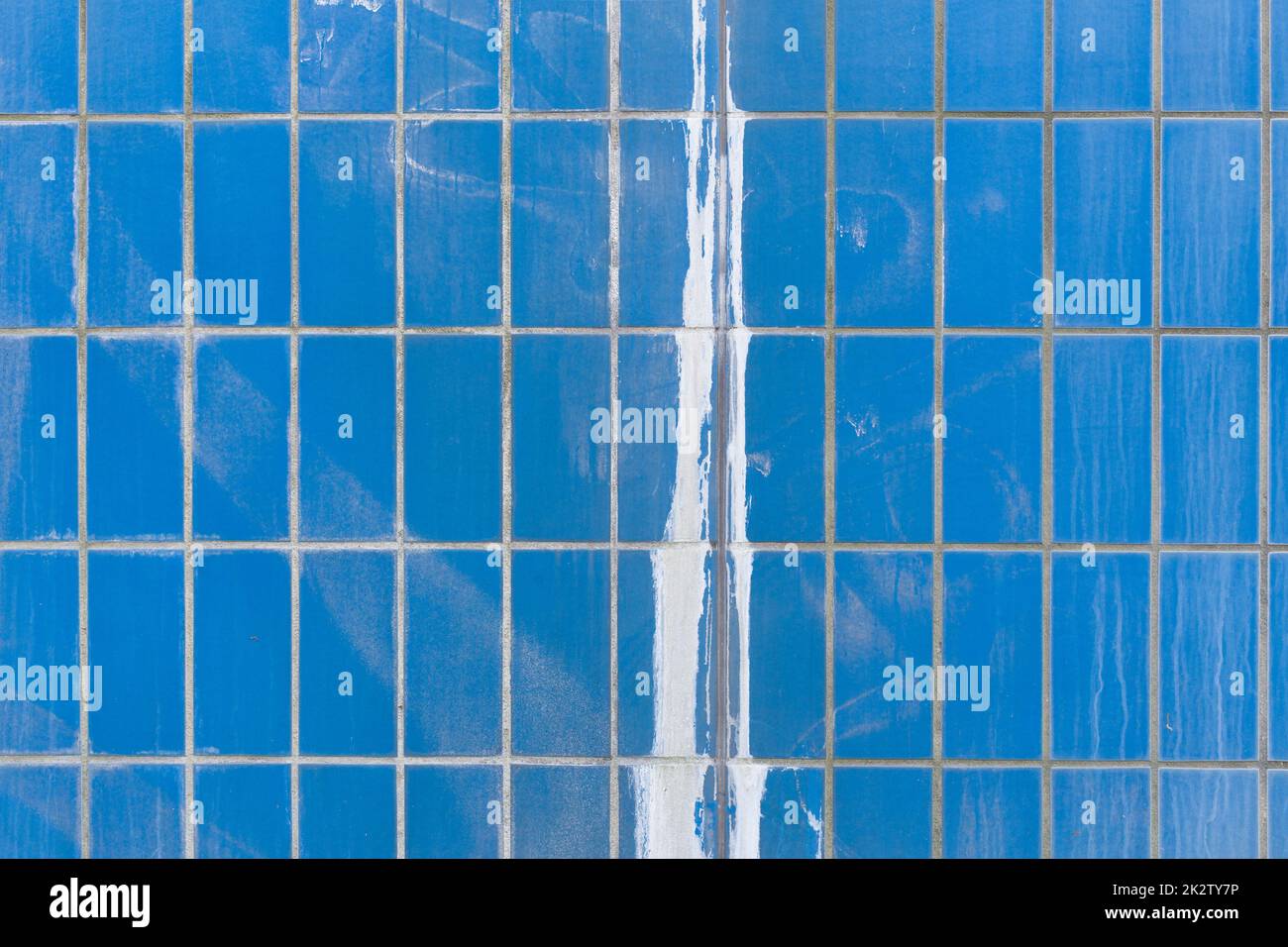 Blue ceramic tile wall with paint splash Stock Photo - Alamy