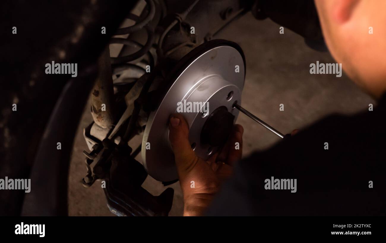 Process of replacement car disc brake Stock Photo - Alamy