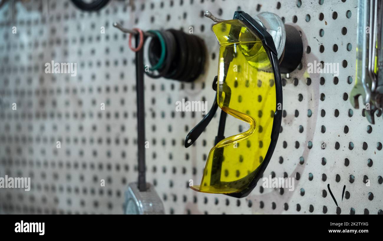 Yellow protection safety glasses Stock Photo - Alamy