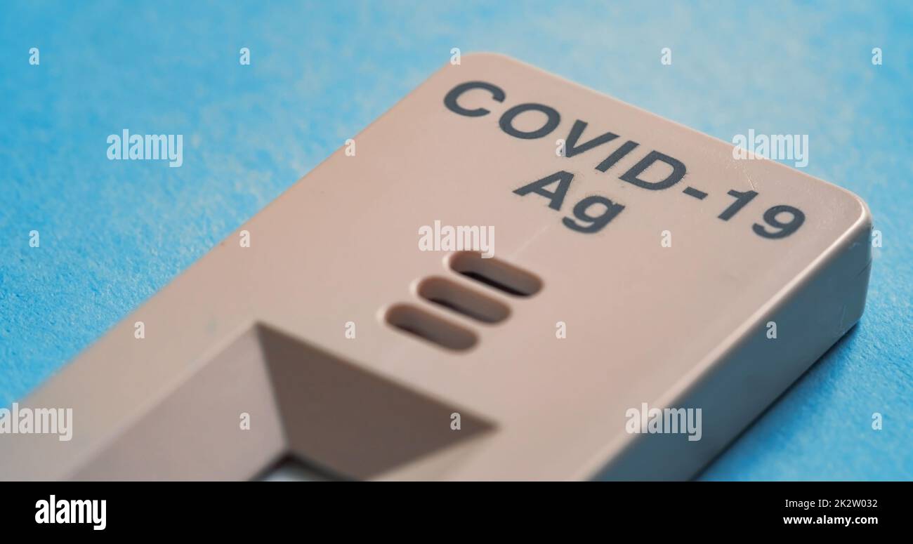 Covid-19 Antigen Test on a blue background Stock Photo - Alamy