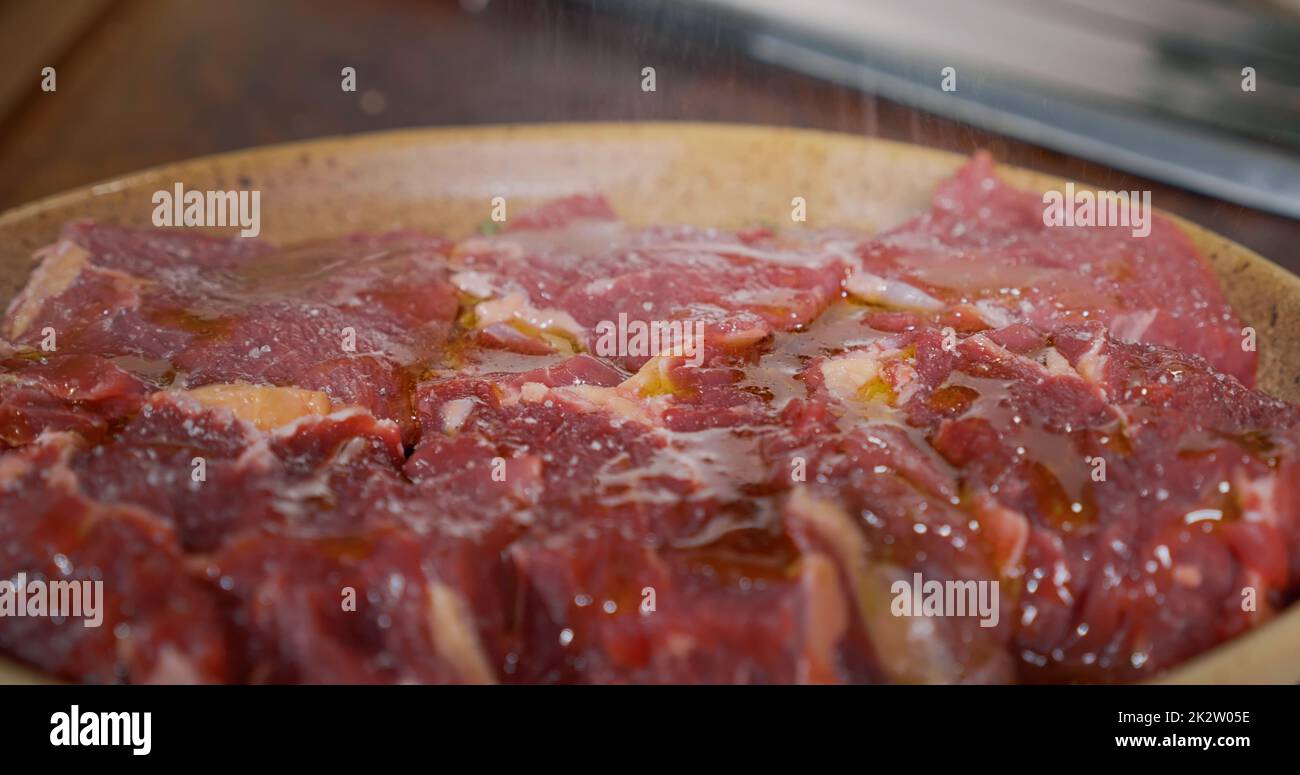 Raw meat seasoning on hi-res stock photography and images - Alamy