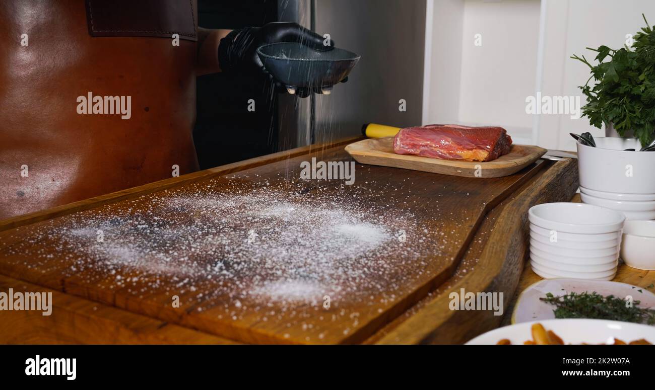 Strewing Salt on Wood Chipper for Fresh Raw Beef Angus Meat Stock Photo ...