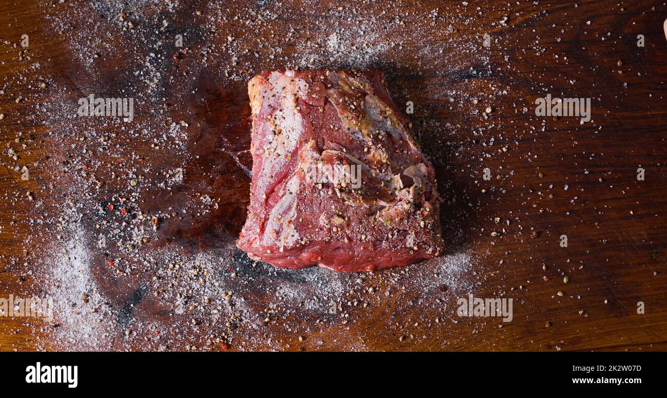Seasoning Meat Concept Top View on a wood chipper Stock Photo - Alamy