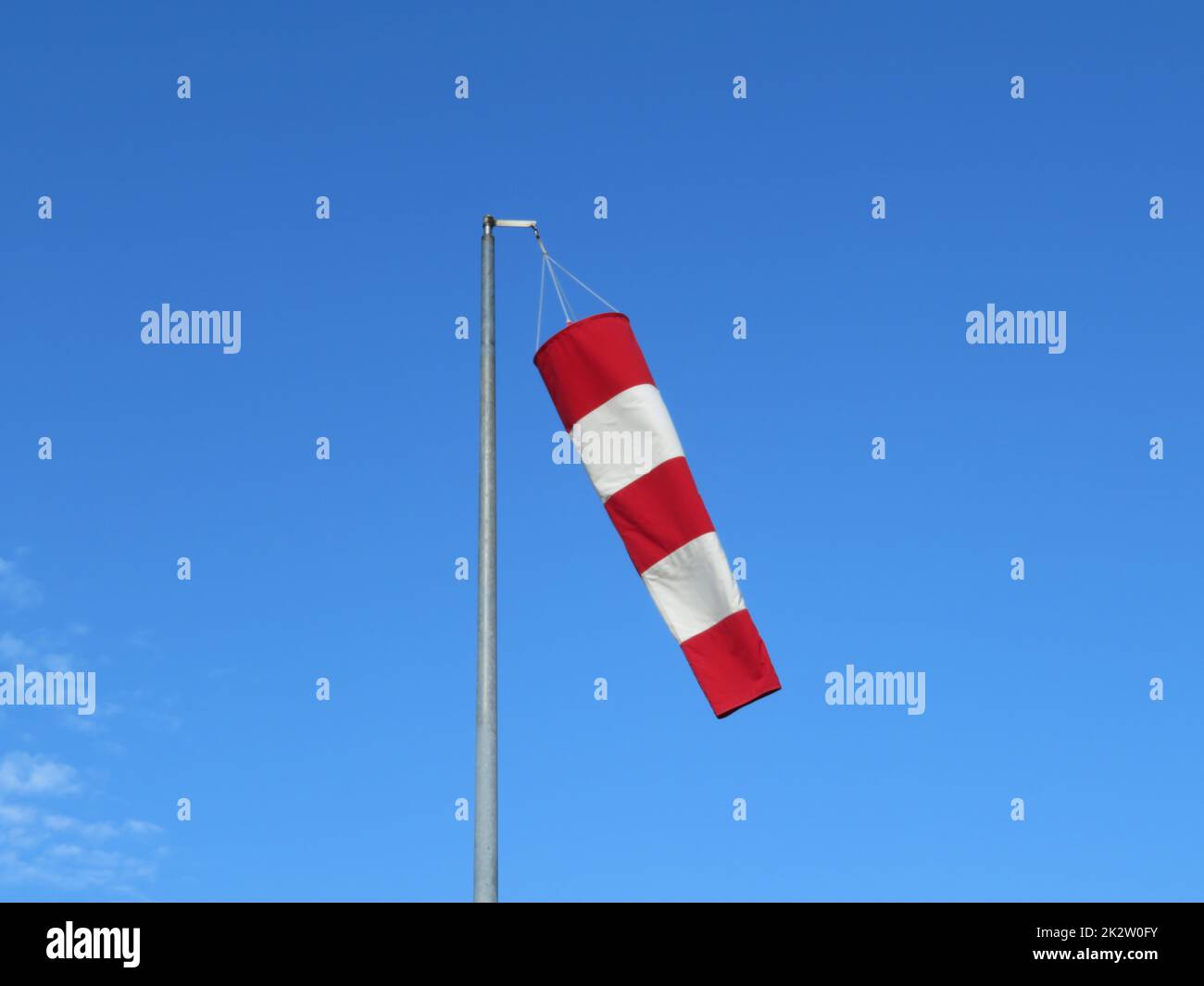 red and white wind indicator safety signal warning Stock Photo - Alamy
