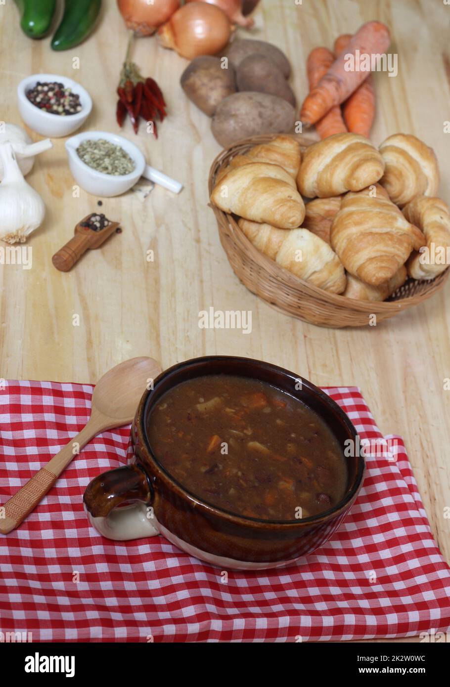 Beef Stew and Fresh Bread in Rustic Kitchen With Red and White ...