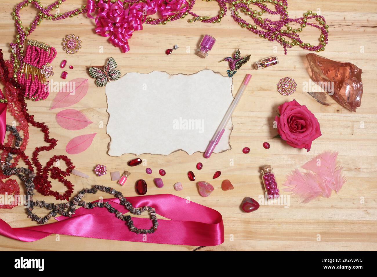 Pink and Magenta Jewelry With Rose and Blank Paper With Burned Edges ...
