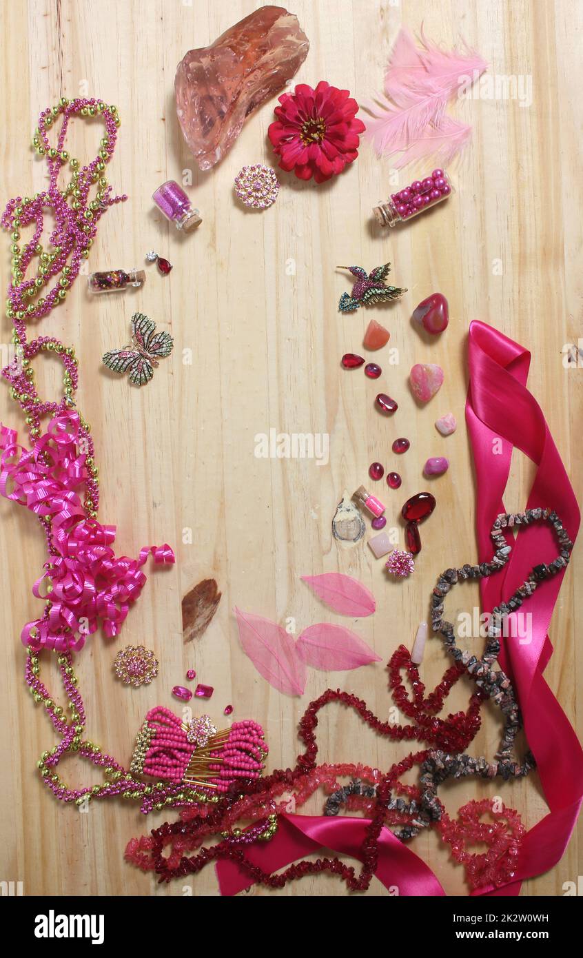 Pink and Magenta Jewelry With Flower on Wooden Table. Top View Stock ...